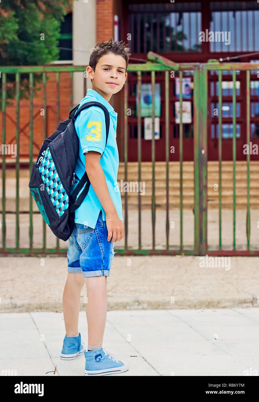 Child goes to school with his backpack Stock Photo - Alamy
