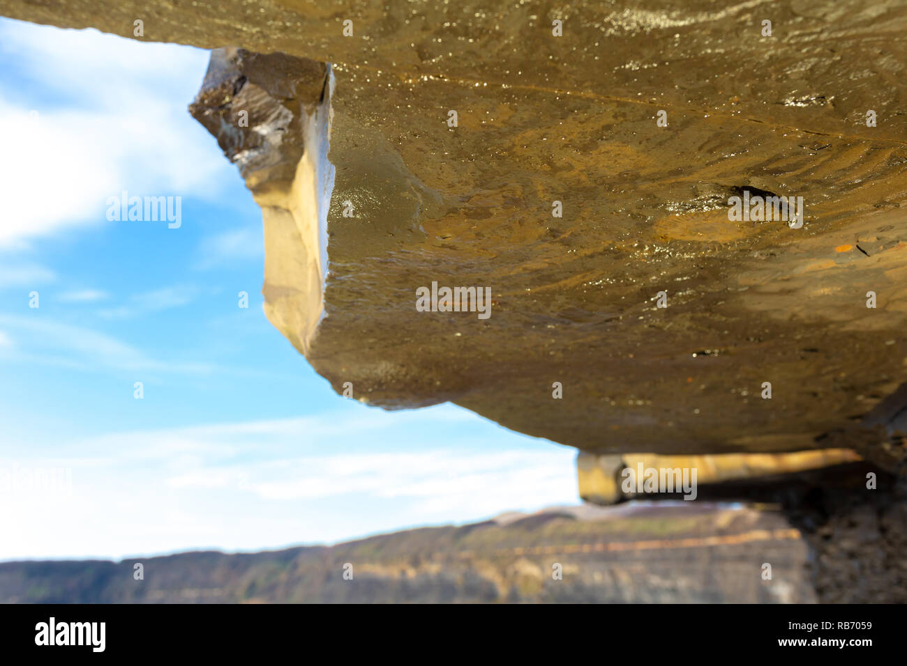 Landscape photograph taken from underneath cliff face overhang focused ...