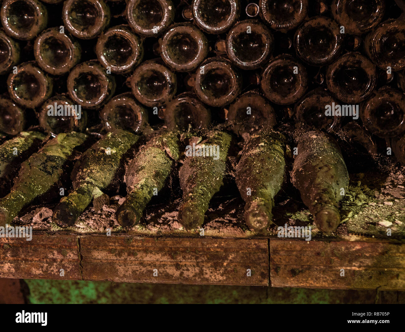 Very old wine bottles stocked in an ancient wine cellar Stock Photo - Alamy