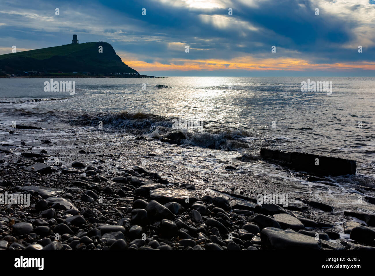 Landscape photograph on Kimmeridge bay beach over wavey water looking ...