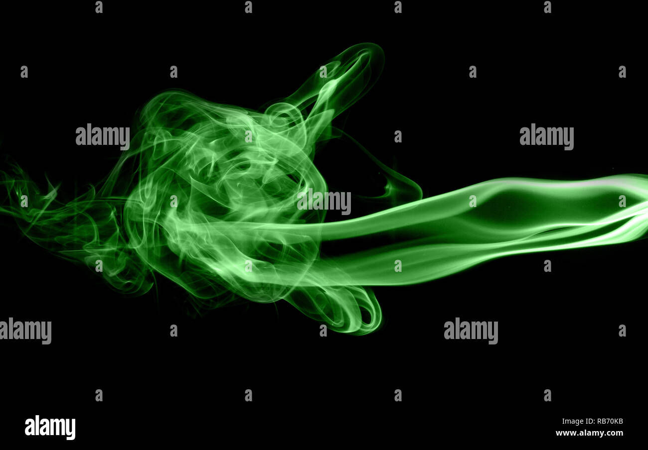 Green smoke on black background Stock Photo - Alamy