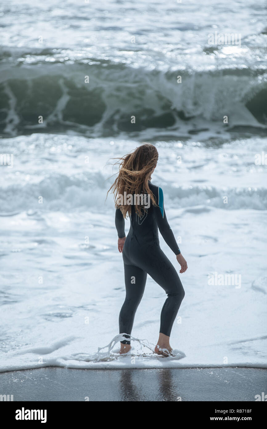 Wearing a wetsuit hi-res stock photography and images - Alamy