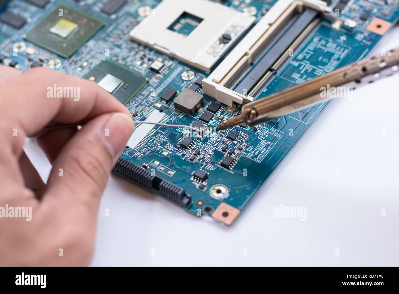 Repair of electronic devices, tin soldering parts Stock Photo - Alamy