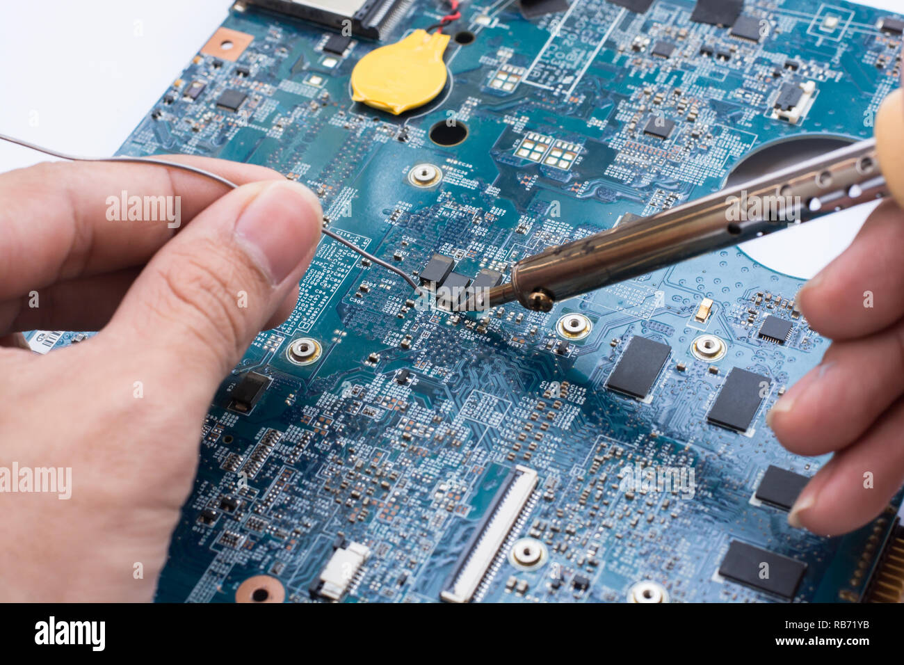 Repair of electronic devices, tin soldering parts Stock Photo - Alamy