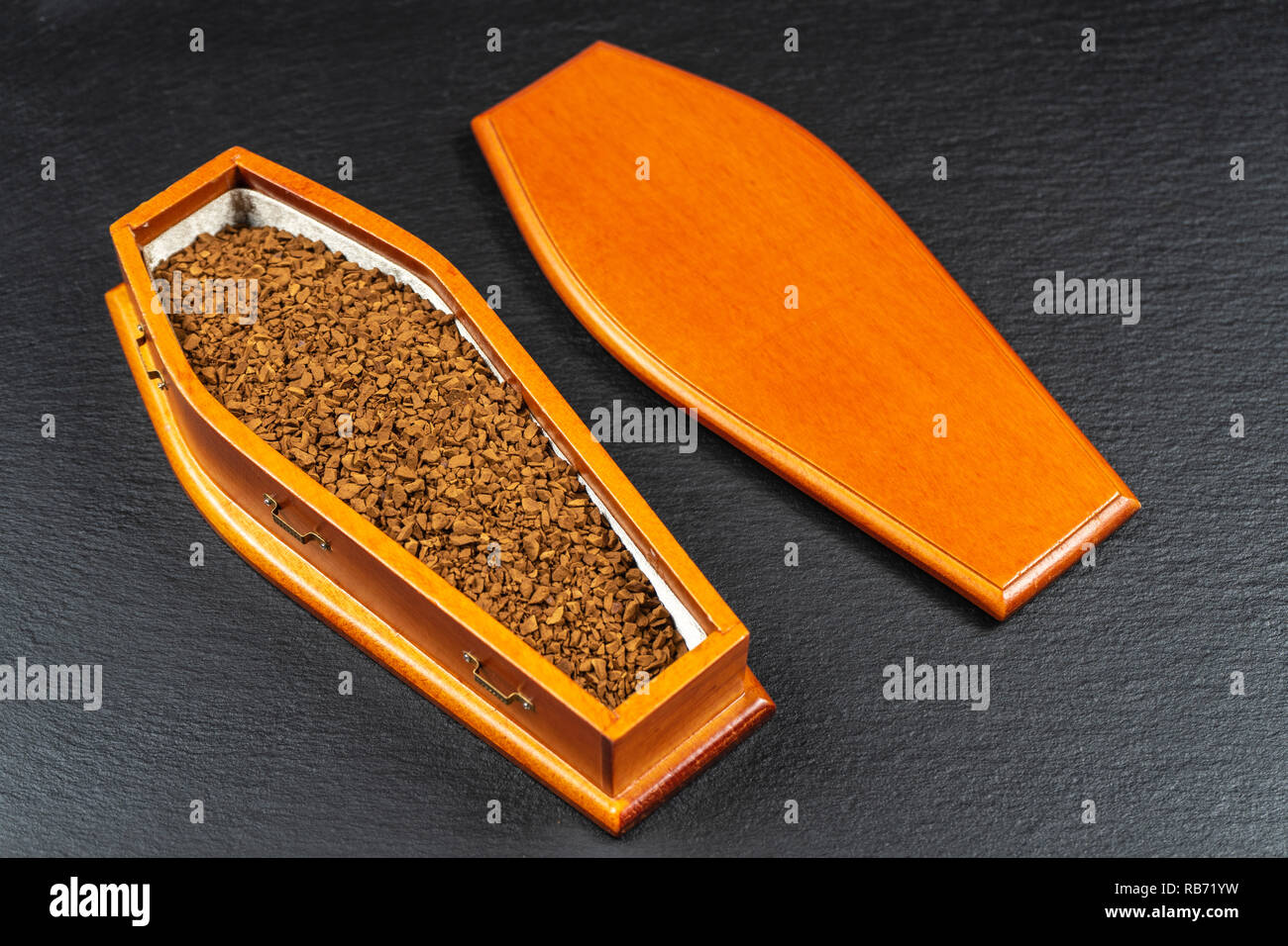 Coffin full of instant coffee.Caffeine kills concept Stock Photo - Alamy