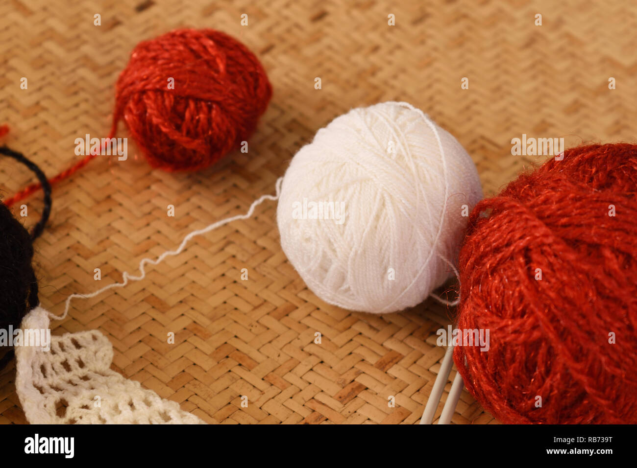 Beautiful red and white round yarn ball Stock Photo - Alamy