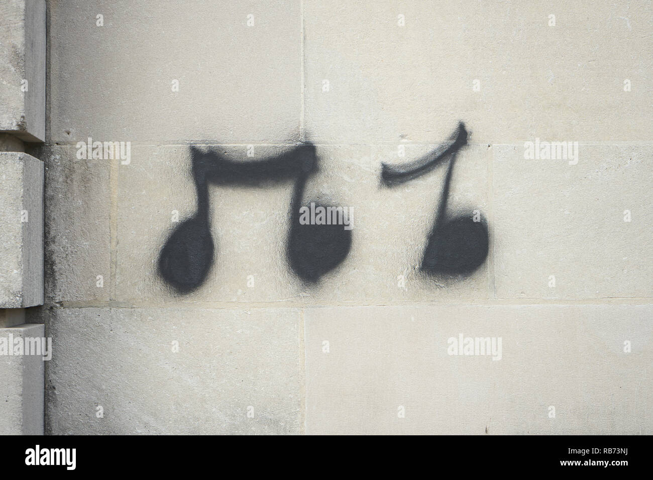 Spray painted music notes on the side of a building Stock Photo - Alamy