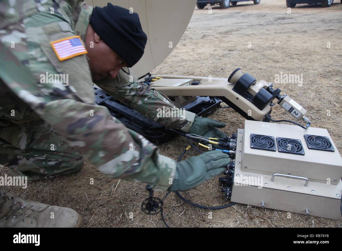 Sgt. Hans Francis, 4th Joint Communications Support Element, assembles ...
