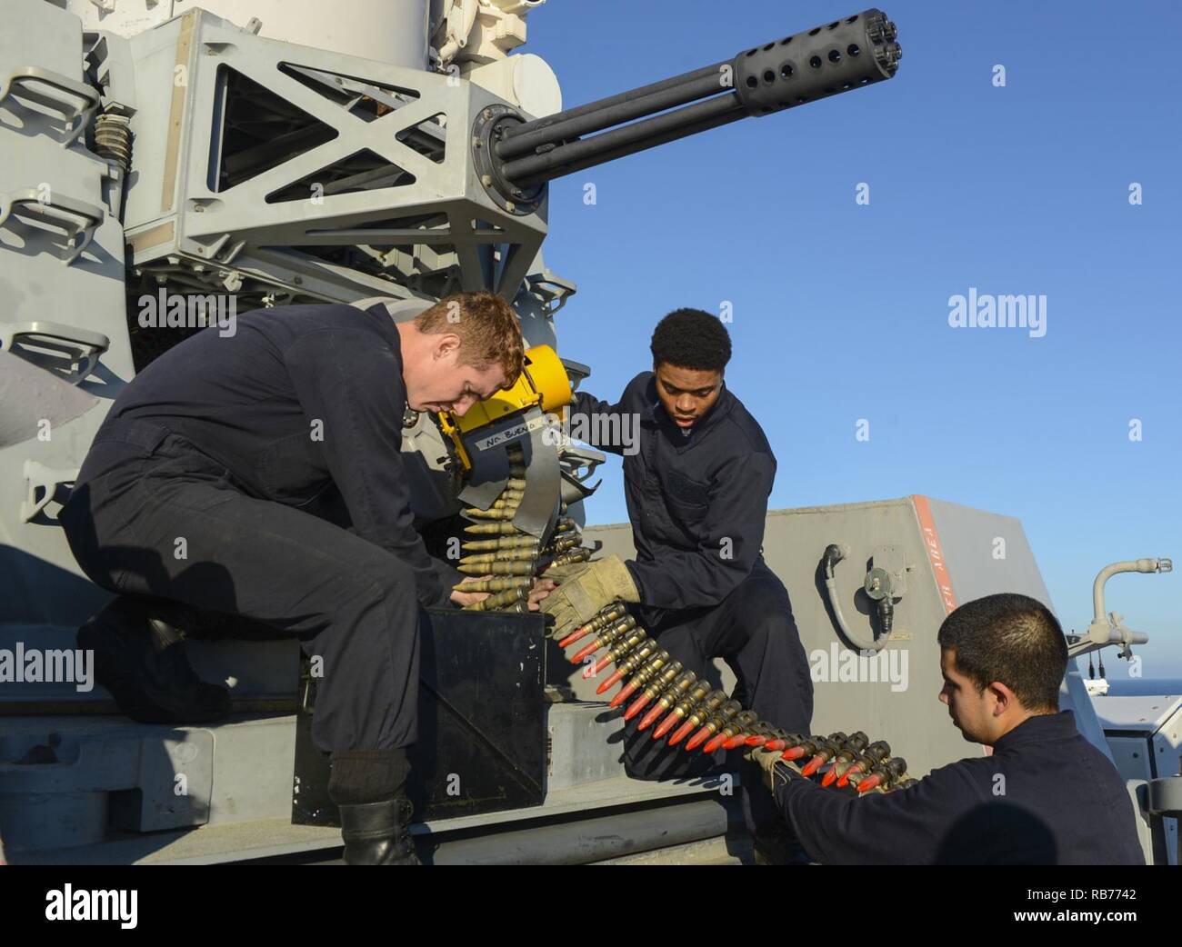 ATLANTIC OCEAN (Dec. 12, 2016) Sailors load “dummy” rounds into a close ...