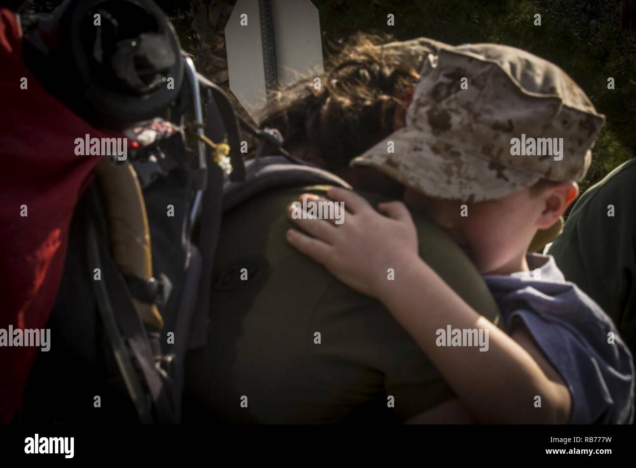 Jon Hancock, a Marine veteran, hugs his son in Marine Corps Base Camp ...