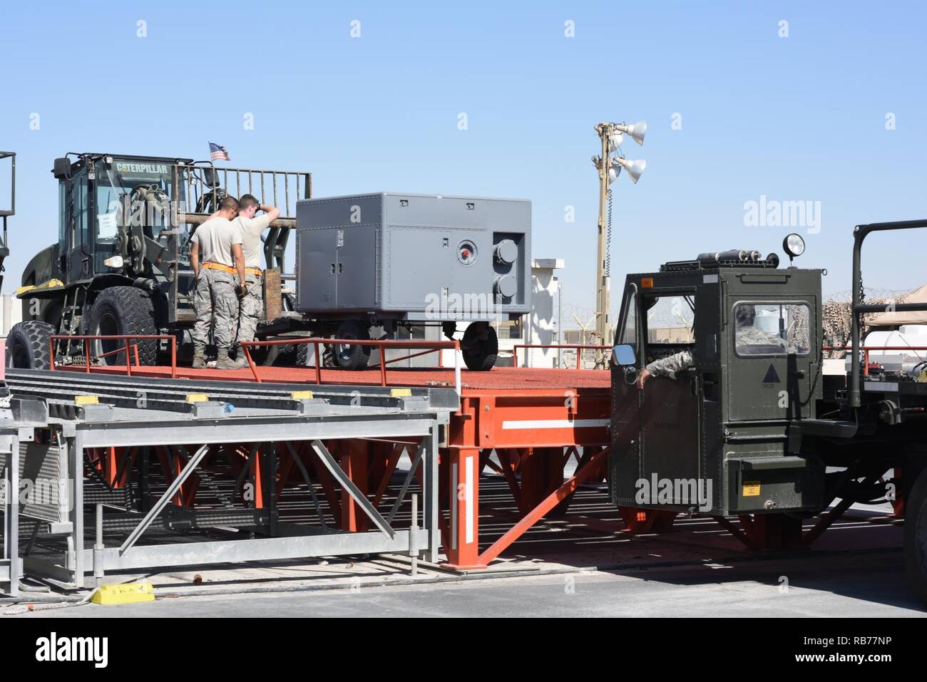 U.S. Air Force Airmen with the 8th Expeditionary Air Mobility Squadron ...