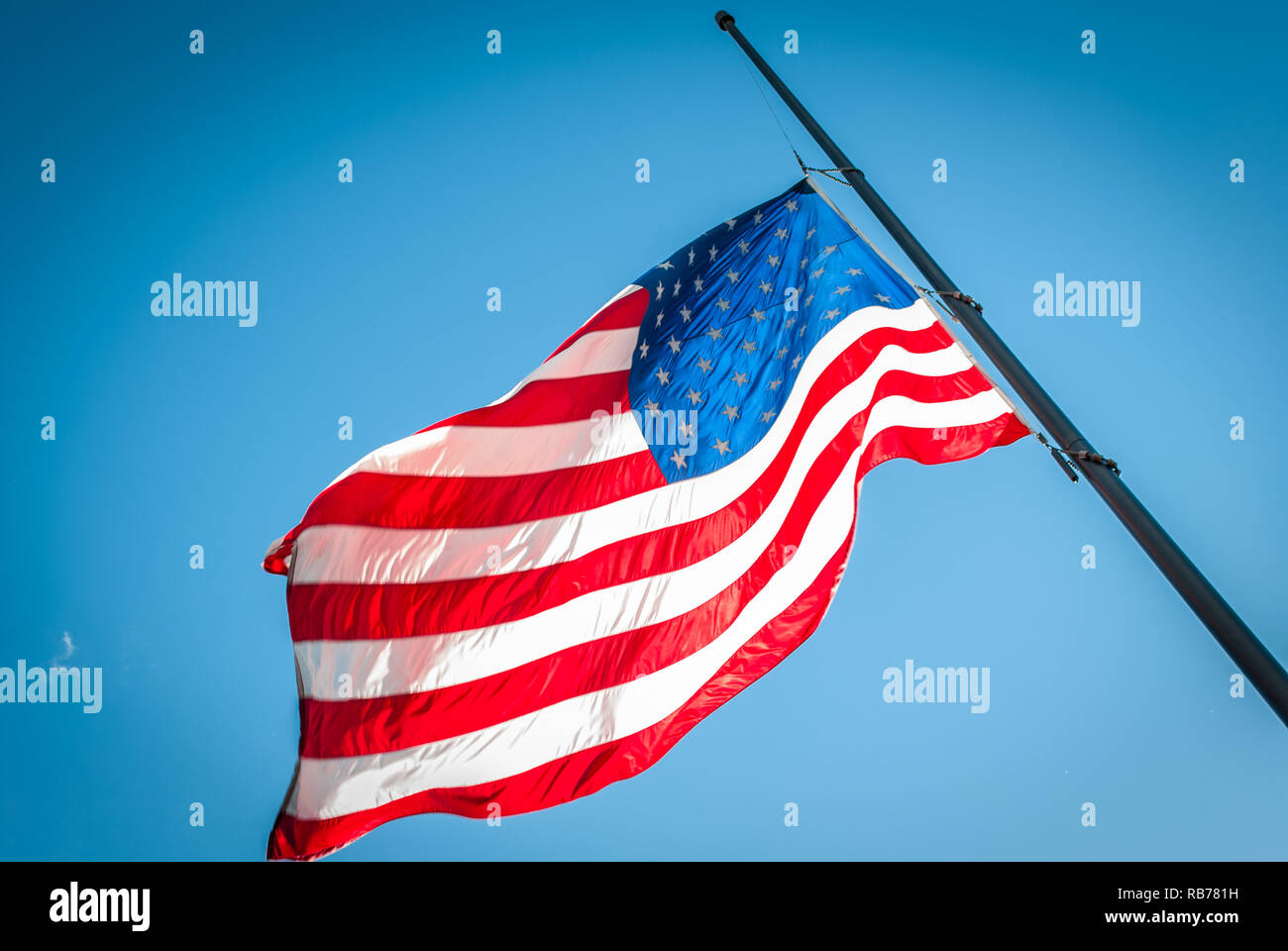 United states of america flag blowing in wind hi-res stock photography ...
