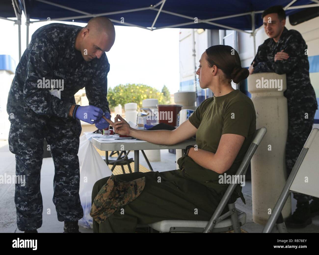 A Marine gets her blood tested for donation aboard Marine Corps Air ...