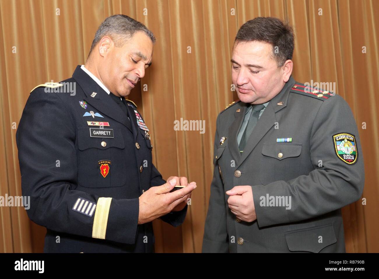 Lt. Gen. Michael Garrett, U.S. Army Central commander, presents his ...