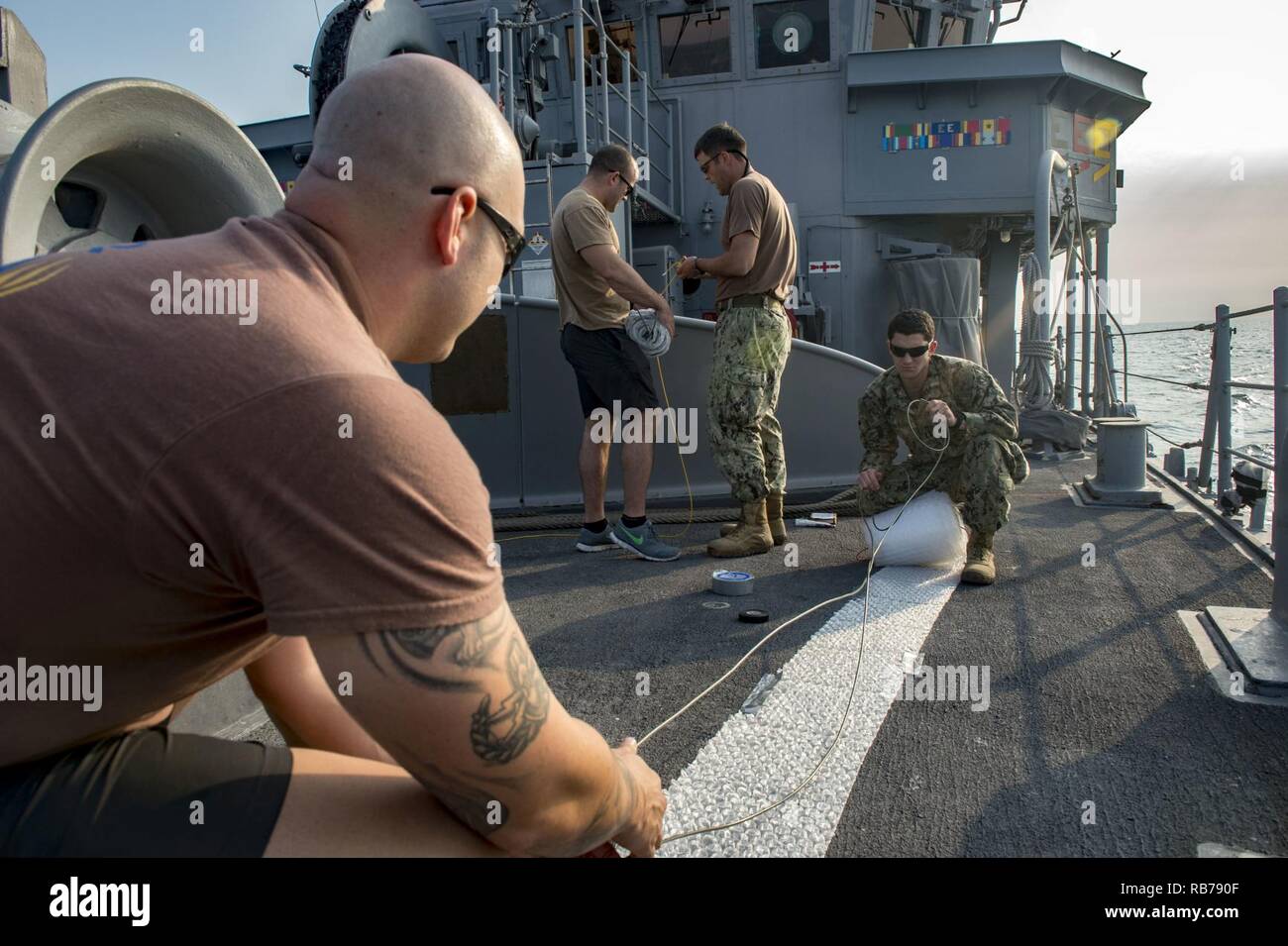 From left, Petty Officer 2nd Class Bryce Hopkins and Lt. j.g. Lawrence ...