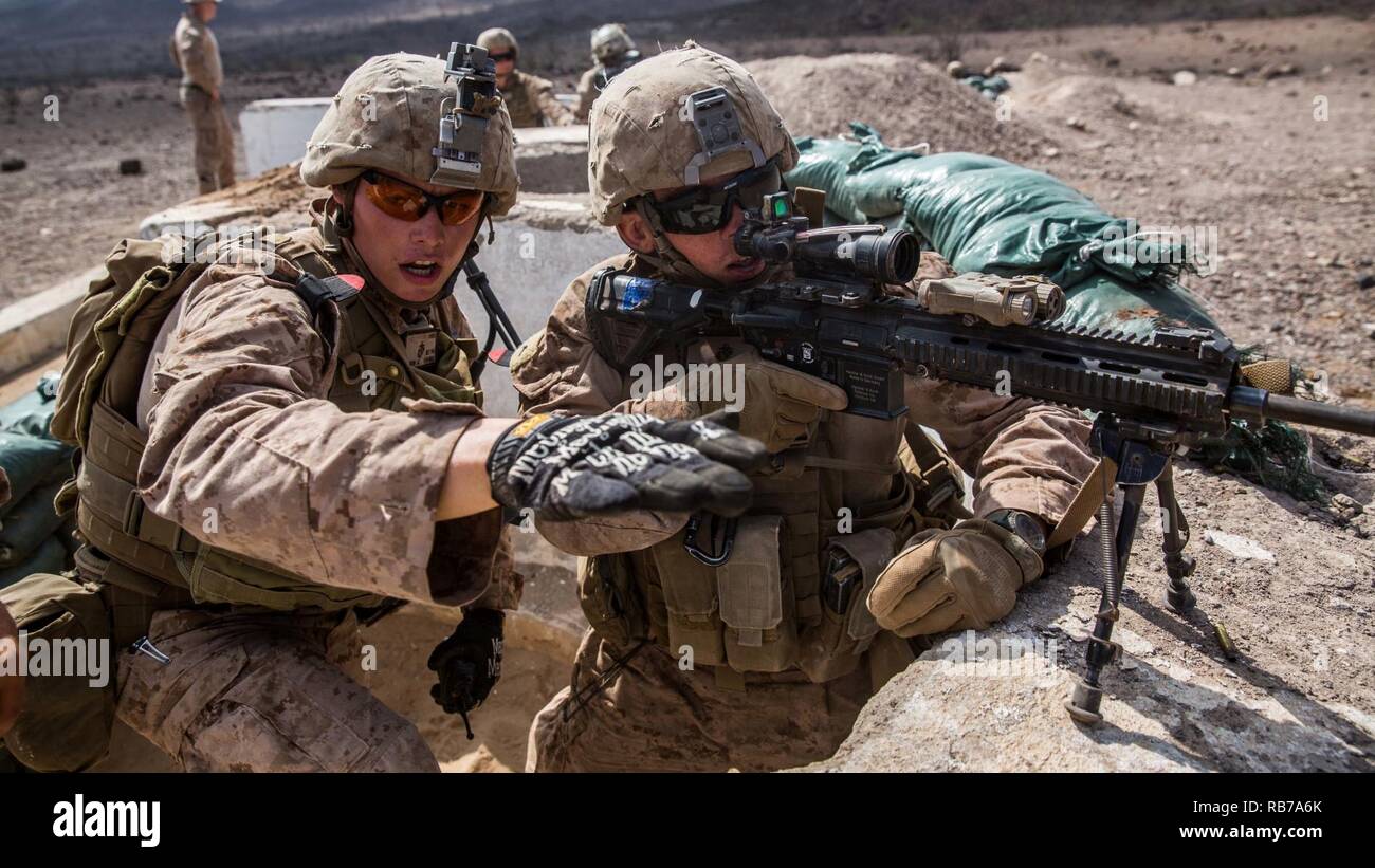 U.S. Marine Corps Cpl. Andrew Wilson, a team leader, instructs U.S ...