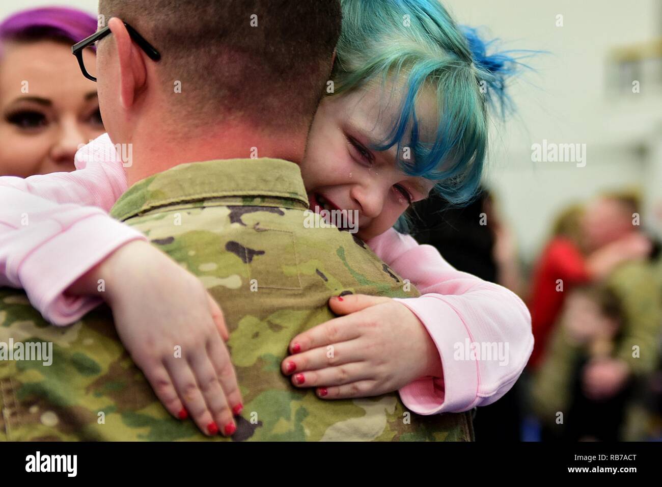 Six-year-old Rose Lowe greets her father, Sgt. Jonathan Lowe of the ...