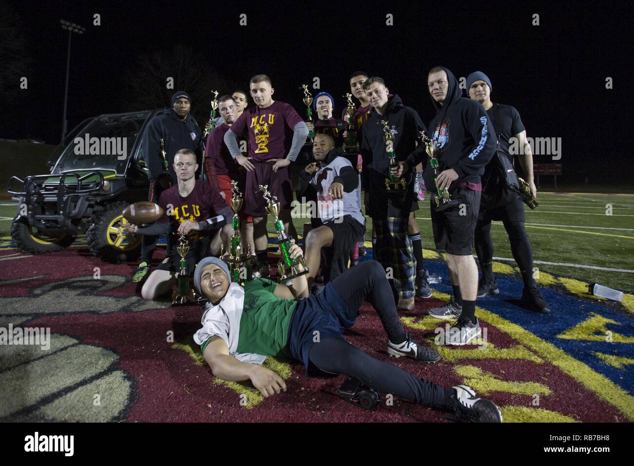 U.S. Marines with the Marine Corps University flag football team pose ...