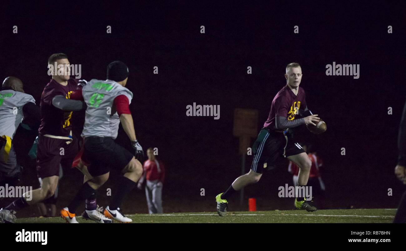 A U.S. Marine with the Marine Corps University flag football team runs ...