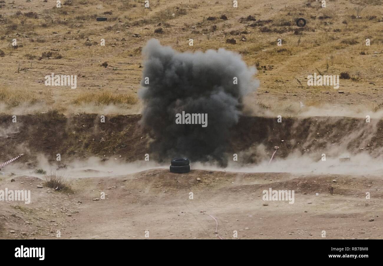 A Pesmerga soldier detonates an improvised explosive device during ...