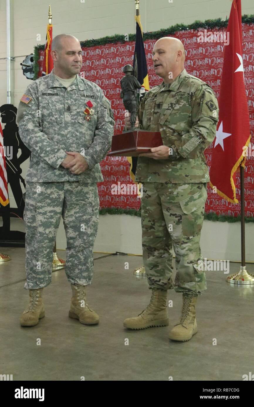 Sgt. Maj. Robert Goldsmith is given the Keeper of the Colors statue by ...