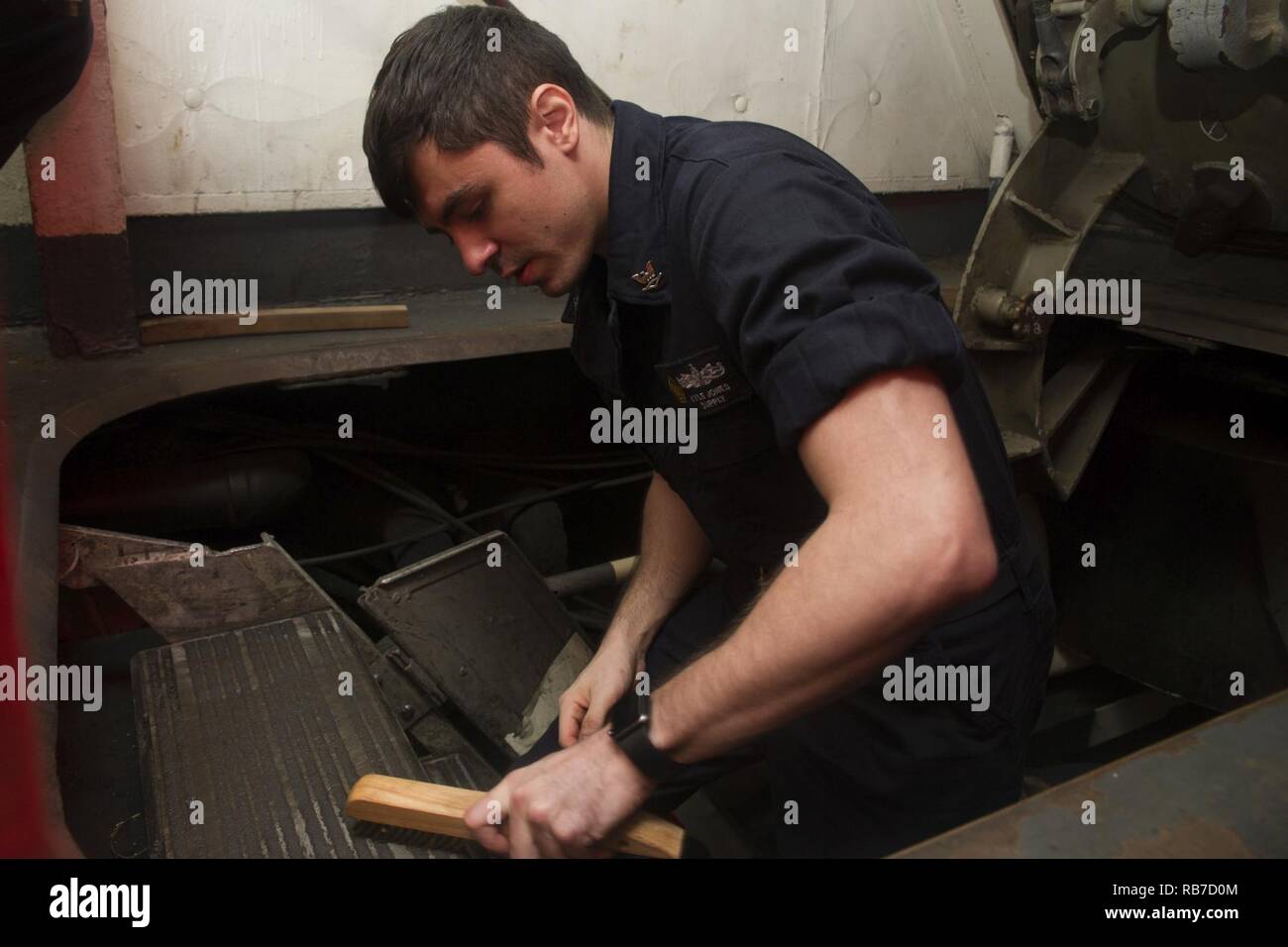 RED SEA (Dec. 2, 2016) Petty Officer 3rd Class Kyle Jones cleans a ...