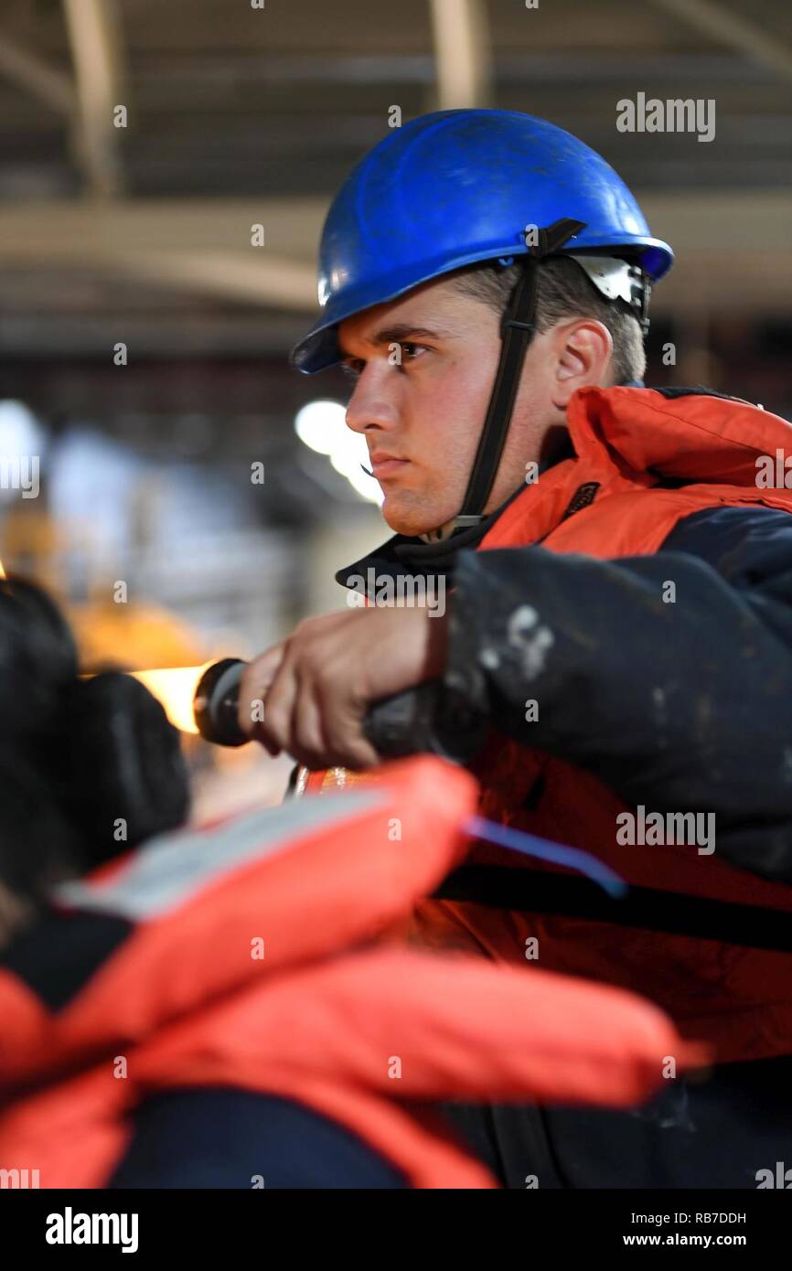 ATLANTIC OCEAN (Dec. 02, 2016) Seaman Quincy Bumstead signals for ...