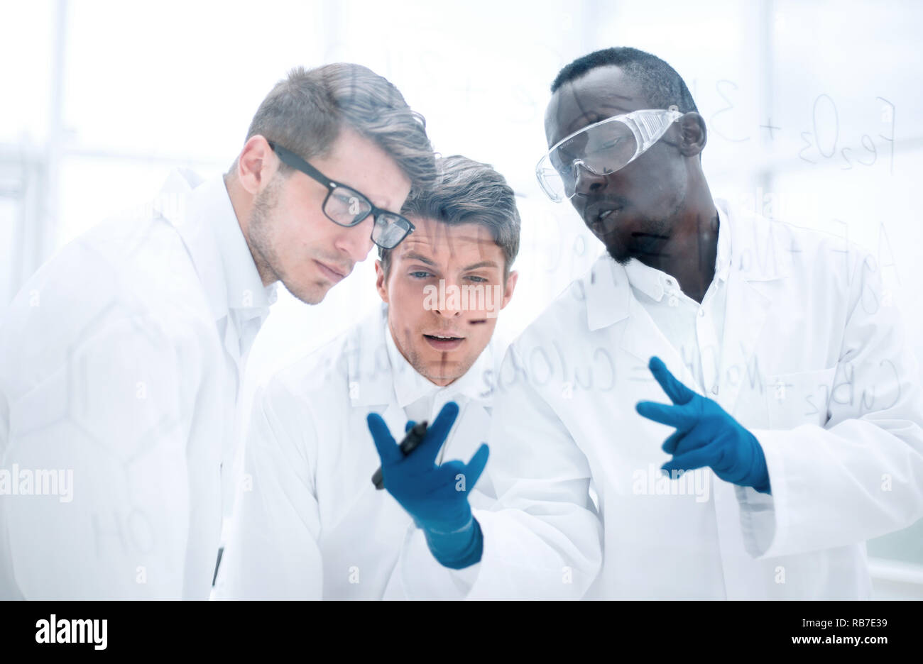 Group laboratory scientists examining hi-res stock photography and ...