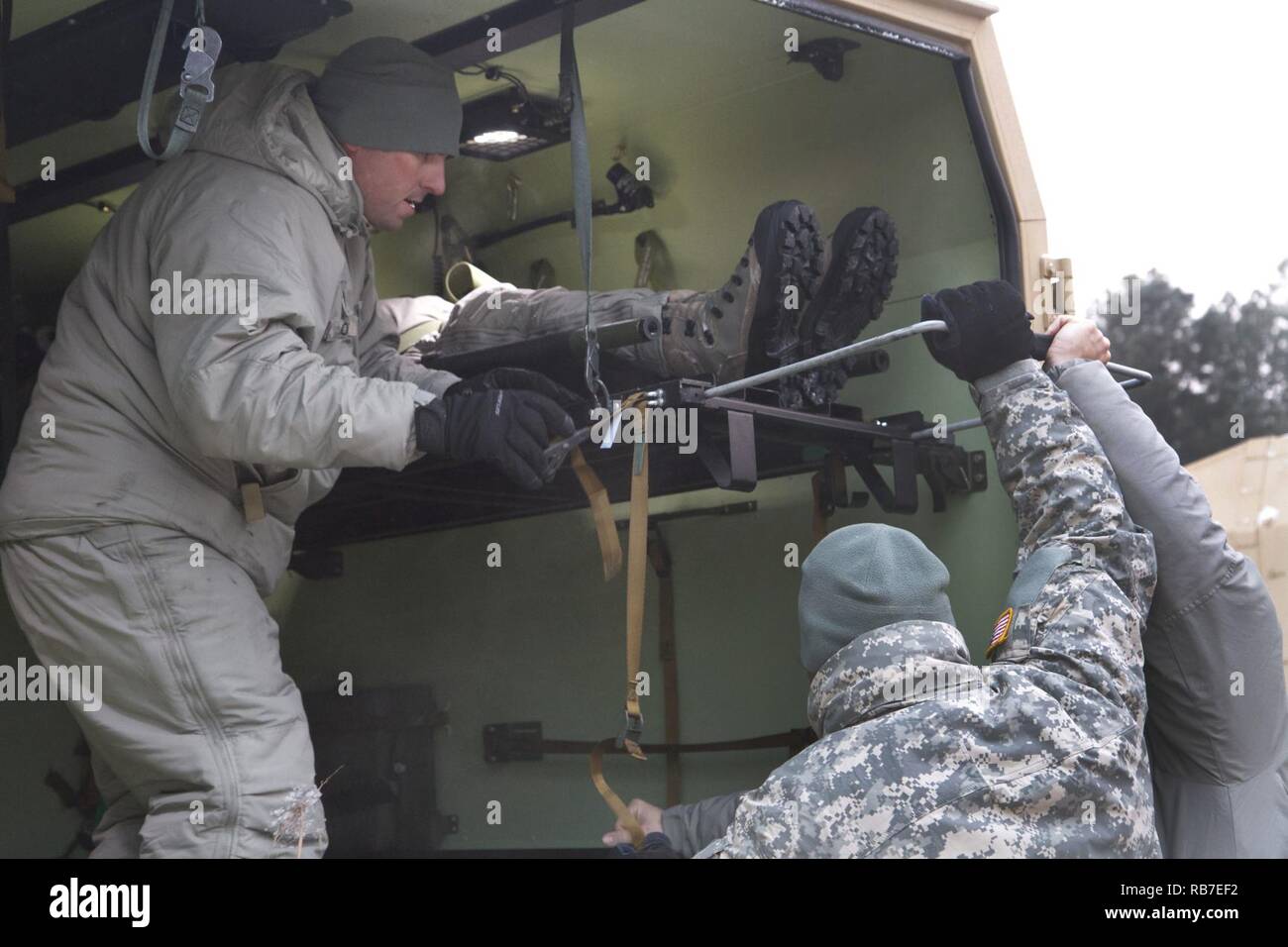 Medics assigned to the 1st Battalion, 157th Infantry Regiment, Colorado ...
