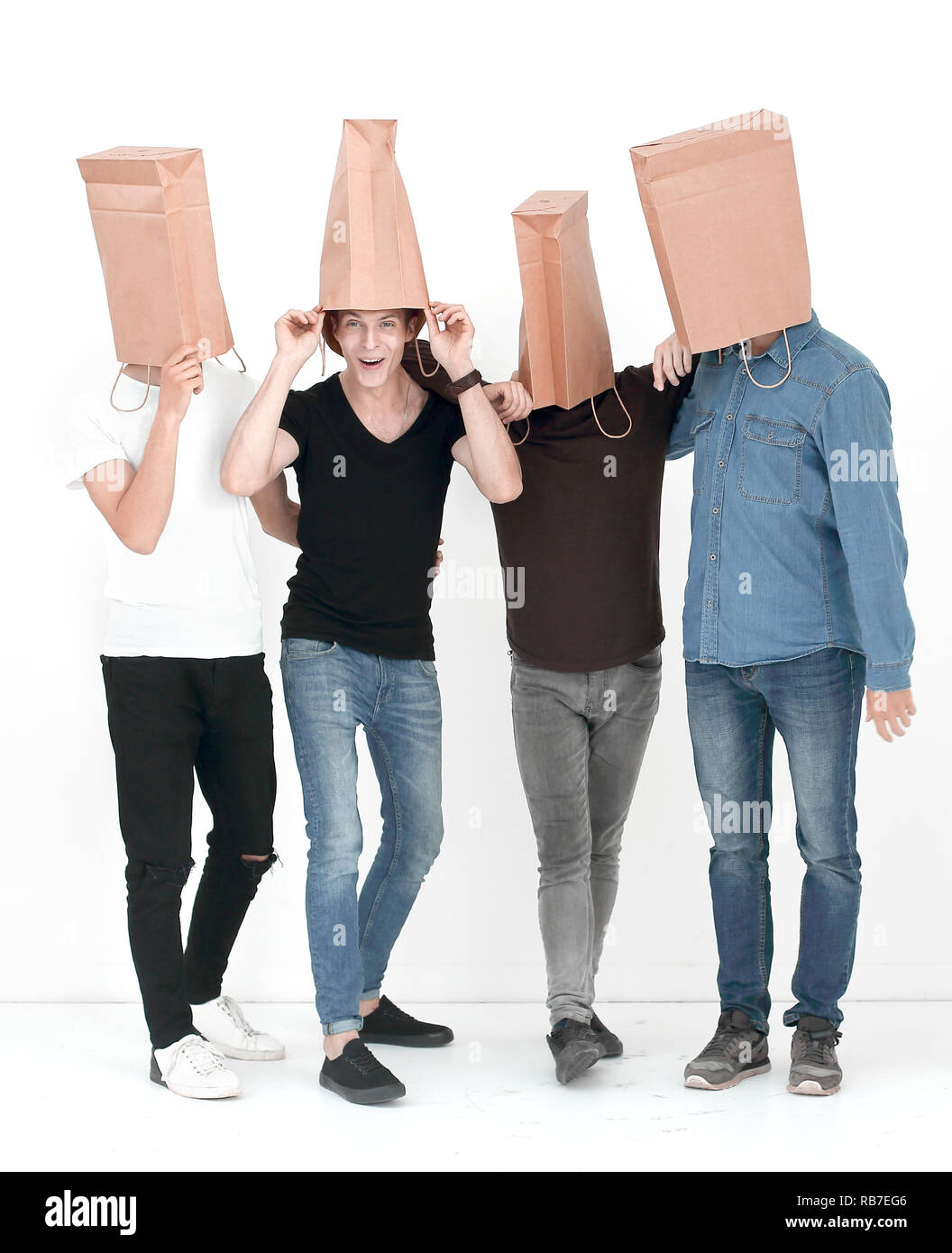 group of young people with paper bags on their heads Stock Photo - Alamy