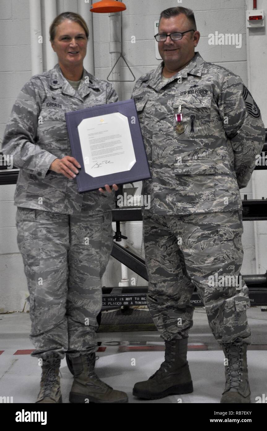 Chief Master Sgt. Mitch Mozingo recieves a letter of appreciation from ...