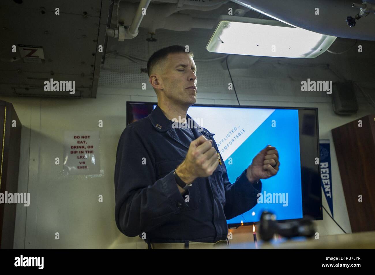 RED SEA (Dec. 03, 2016) Lt. Mark Cook, from Seattle, prays during ...