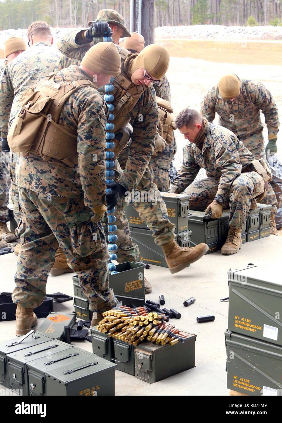 Marines prepare ammunition for a live-fire range during a deployment ...