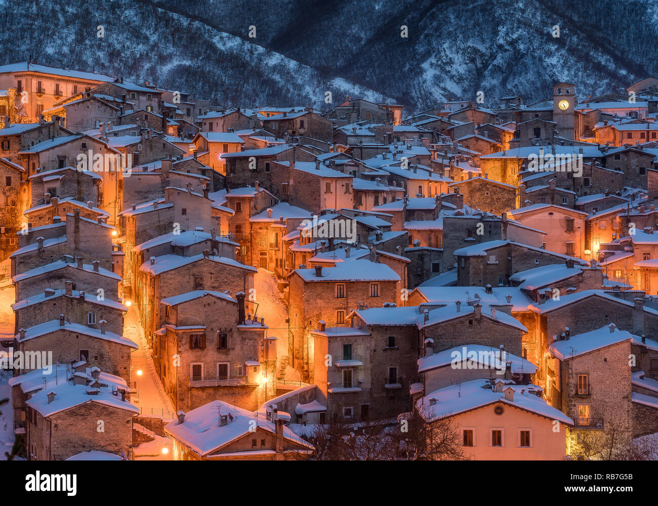 The beautiful Scanno covered in snow during a cold winter evening ...