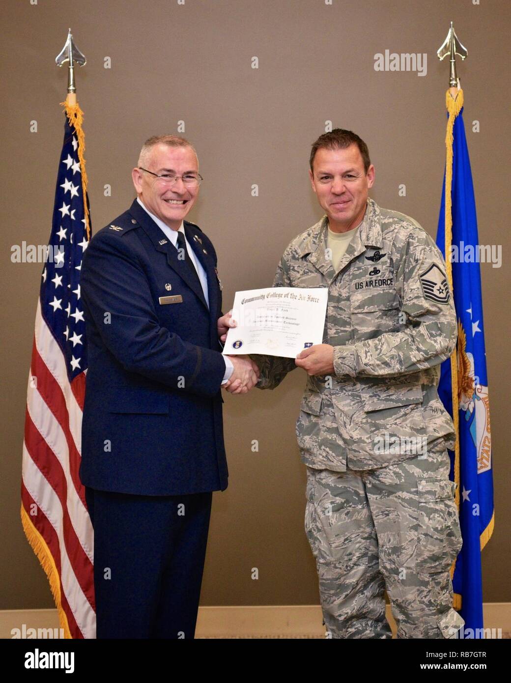 Col. Jonathan Philebaum, commander, 932nd Airlift Wing, presents a ...