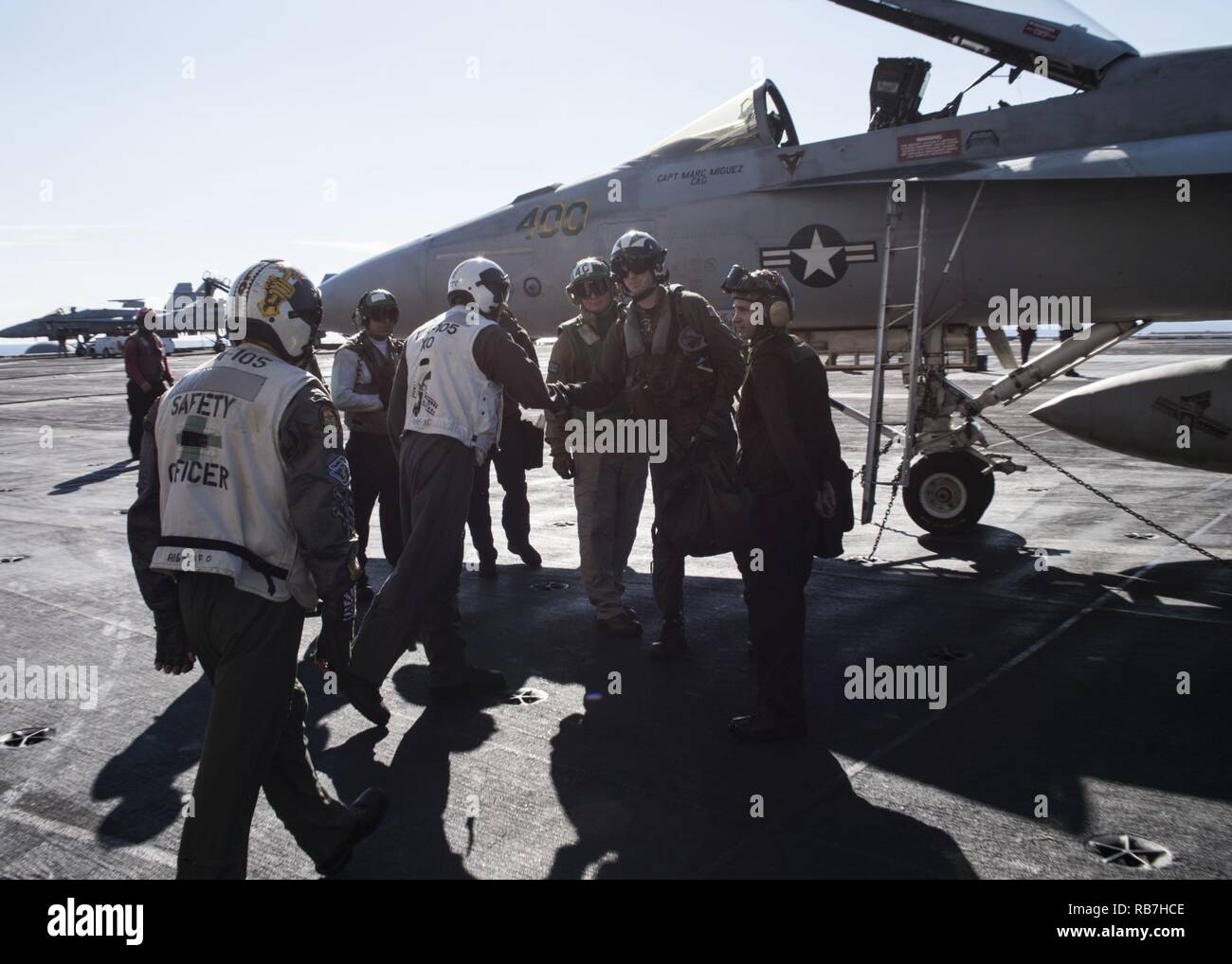 Cmdr. Andrew Mariner, right, former commanding officer of the ...