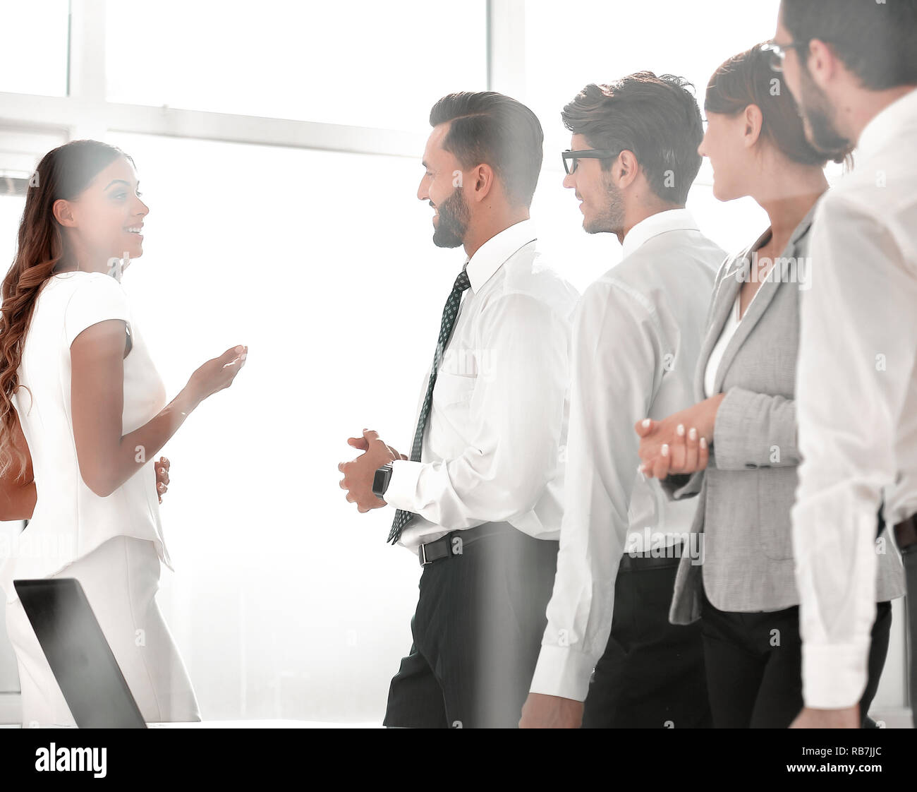 business team looks out the office window Stock Photo - Alamy