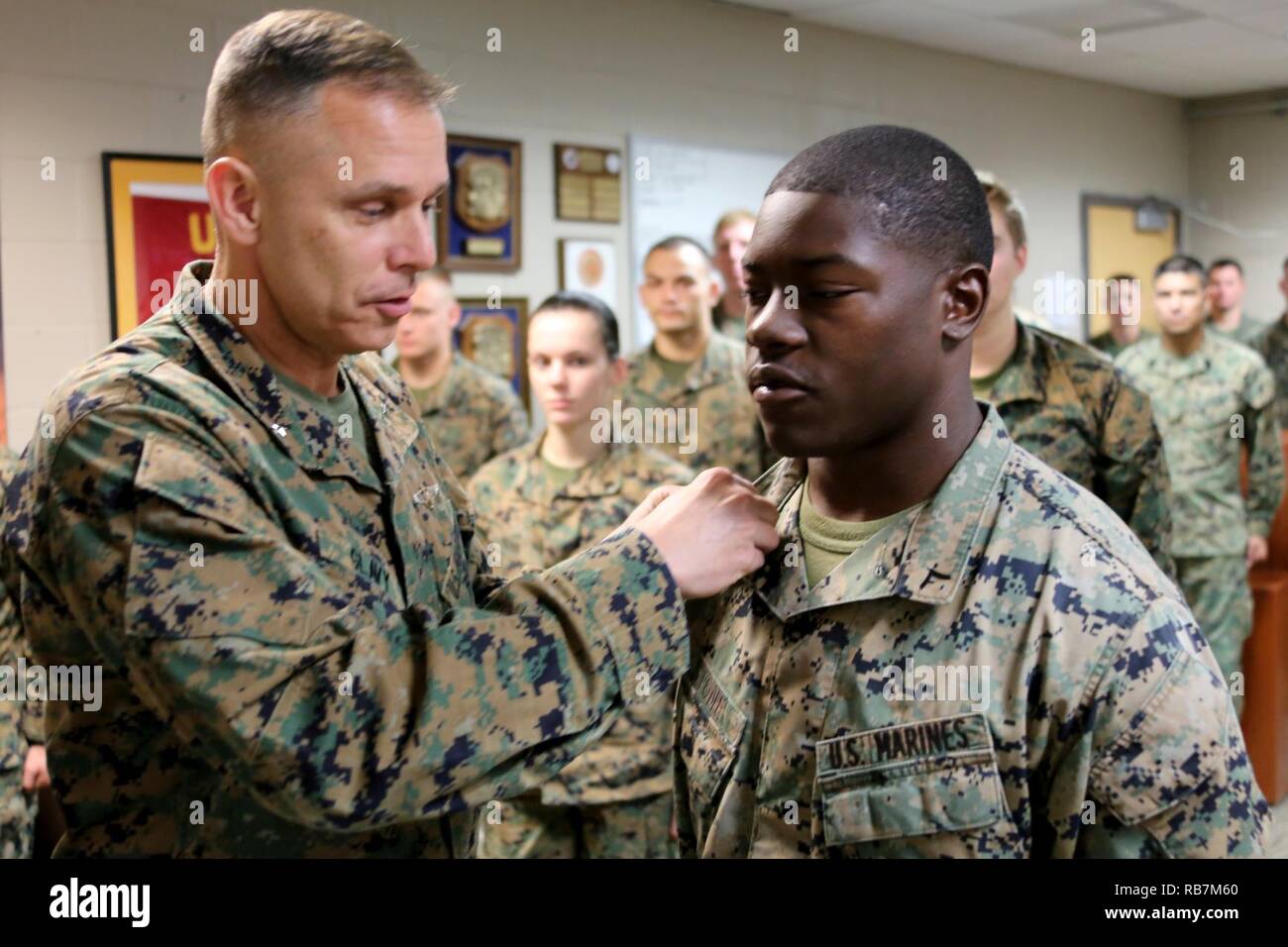 Brig. Gen. Matthew Glavy, left, removes private first class rank ...
