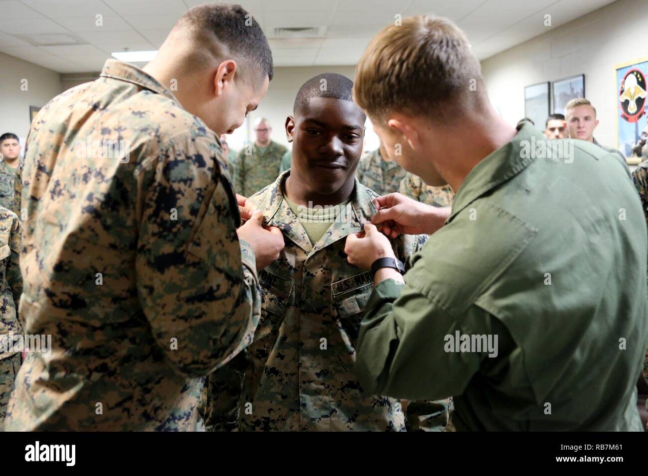 Cpl. Khalid Rahman, left, and Lance Cpl. John Batchelor II pin new ...
