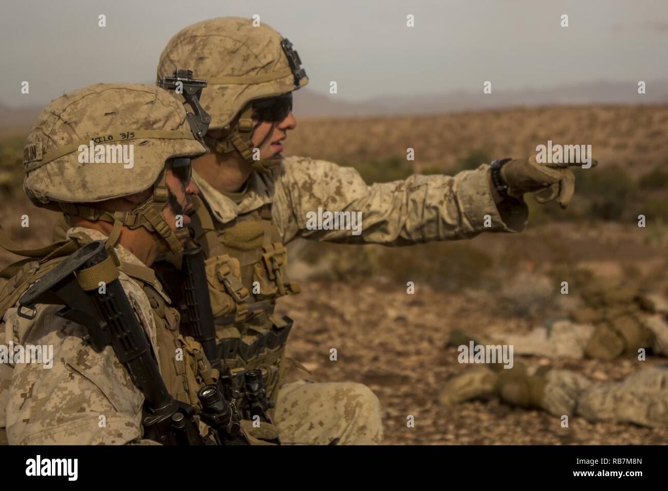 U.S. Marine Corps Lance Cpl. Aaron White and Lance Cpl. Eric Lawrence ...