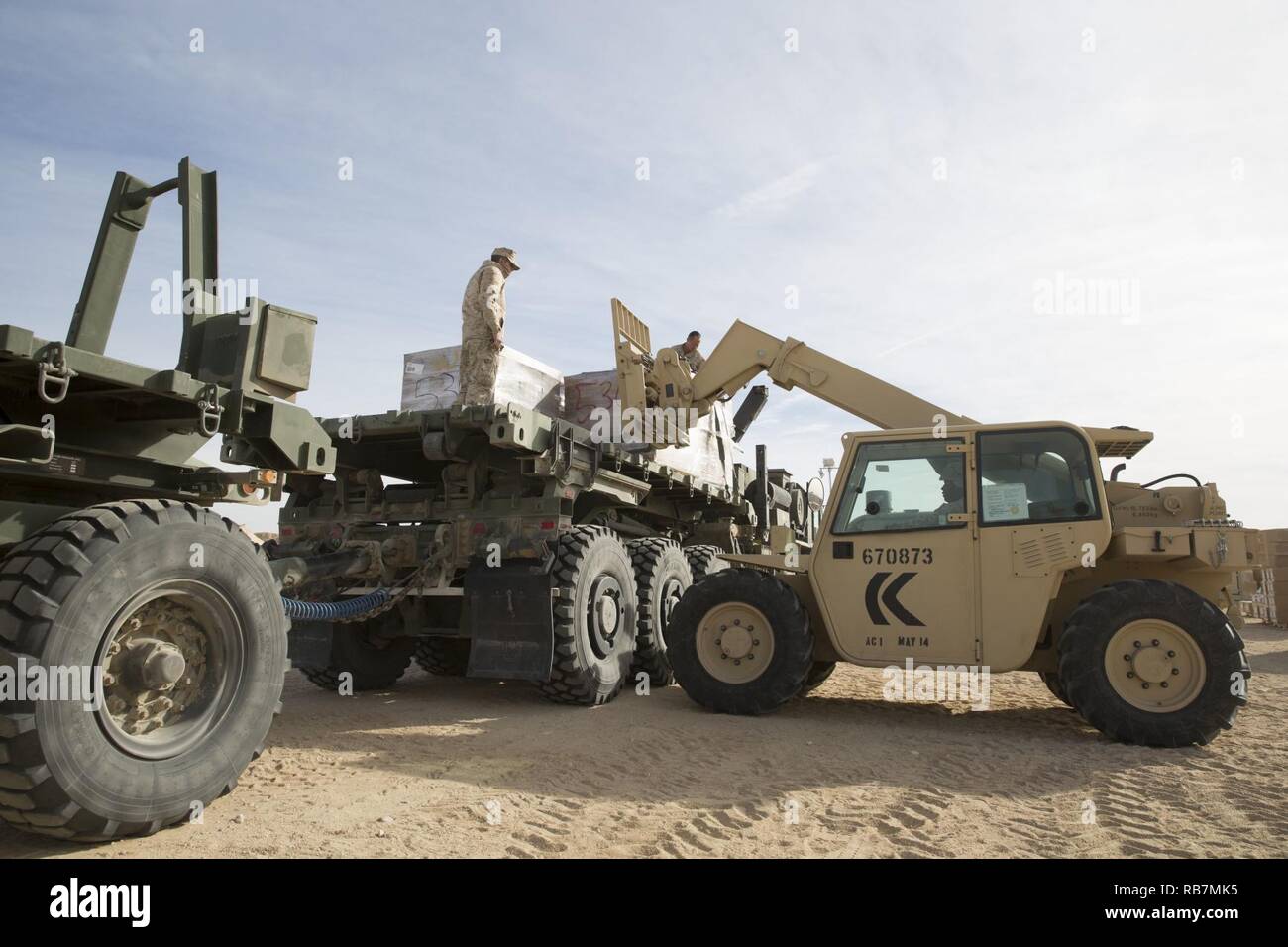U.S. Marines with 1st Supply Battalion, 1st Marine Logistics Group load ...