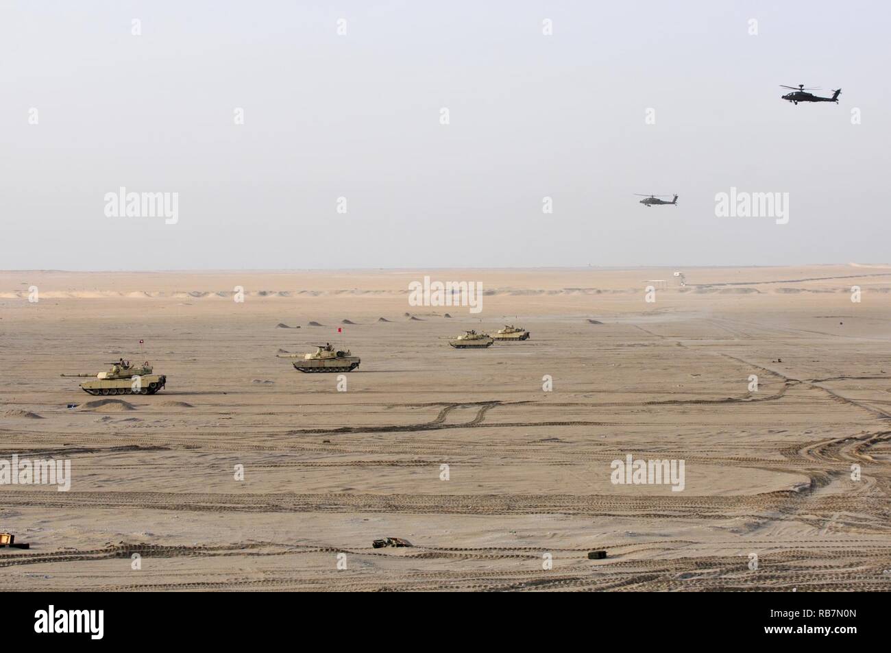 M1A2 Abrams Main Battle Tanks move to engage targets during a joint ...