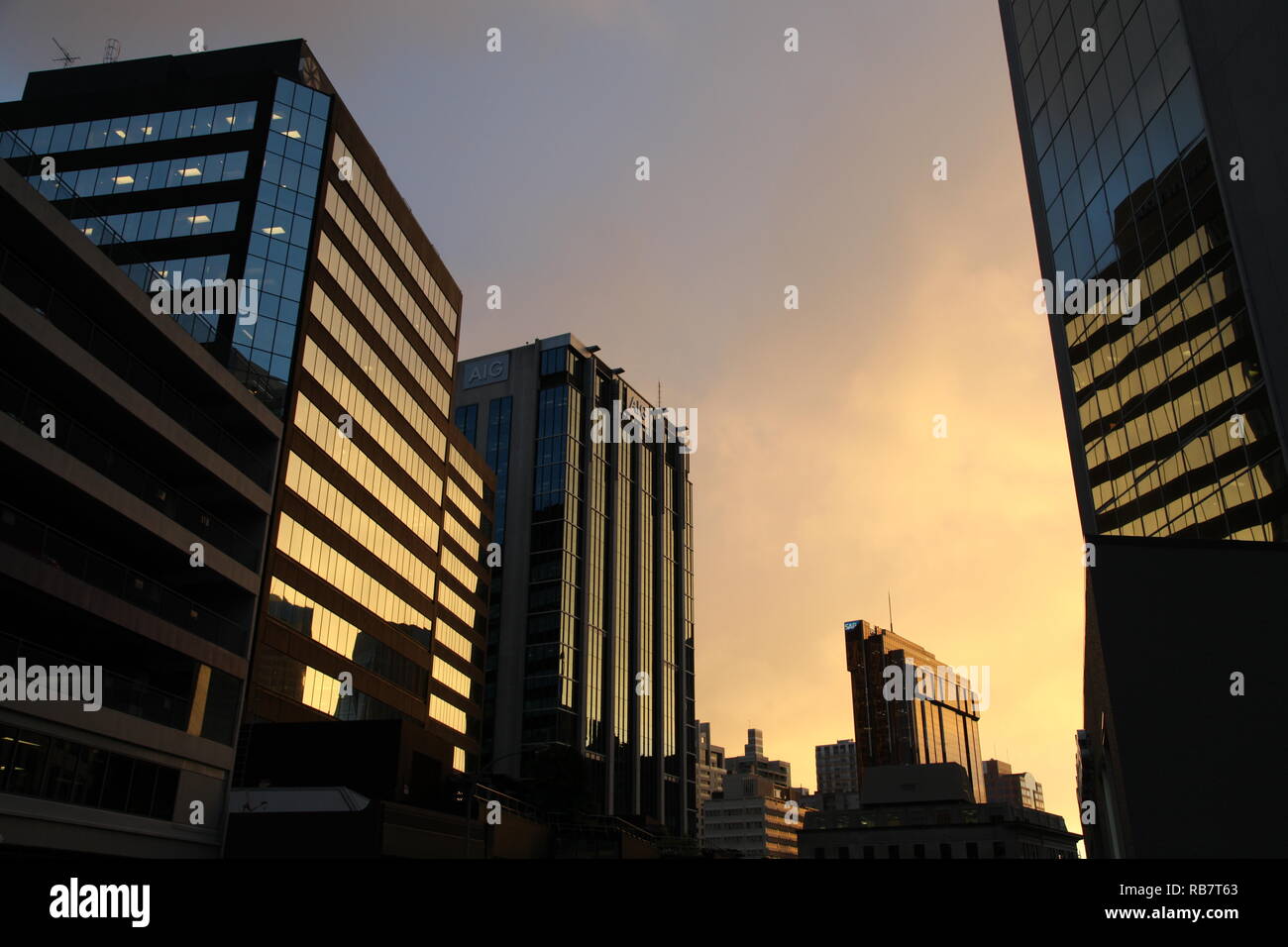High rise office building at sunset in the city Stock Photo - Alamy