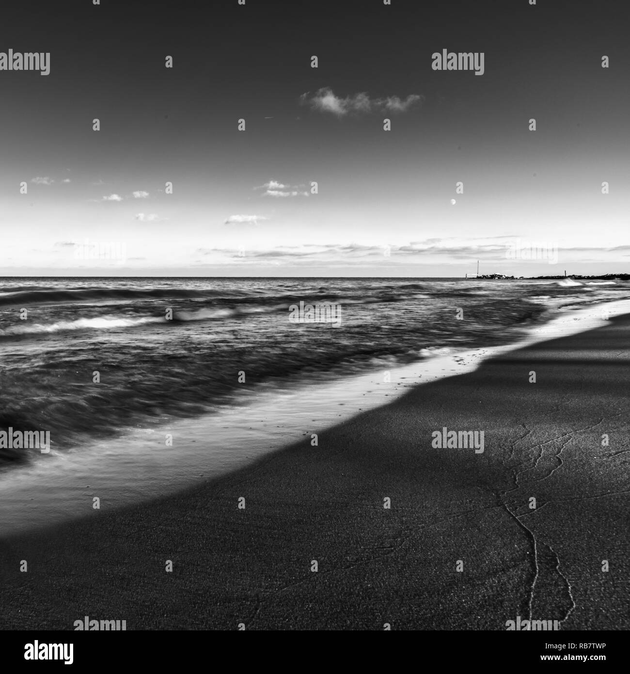 Sandy beach cloudy sky background Black and White Stock Photos & Images ...