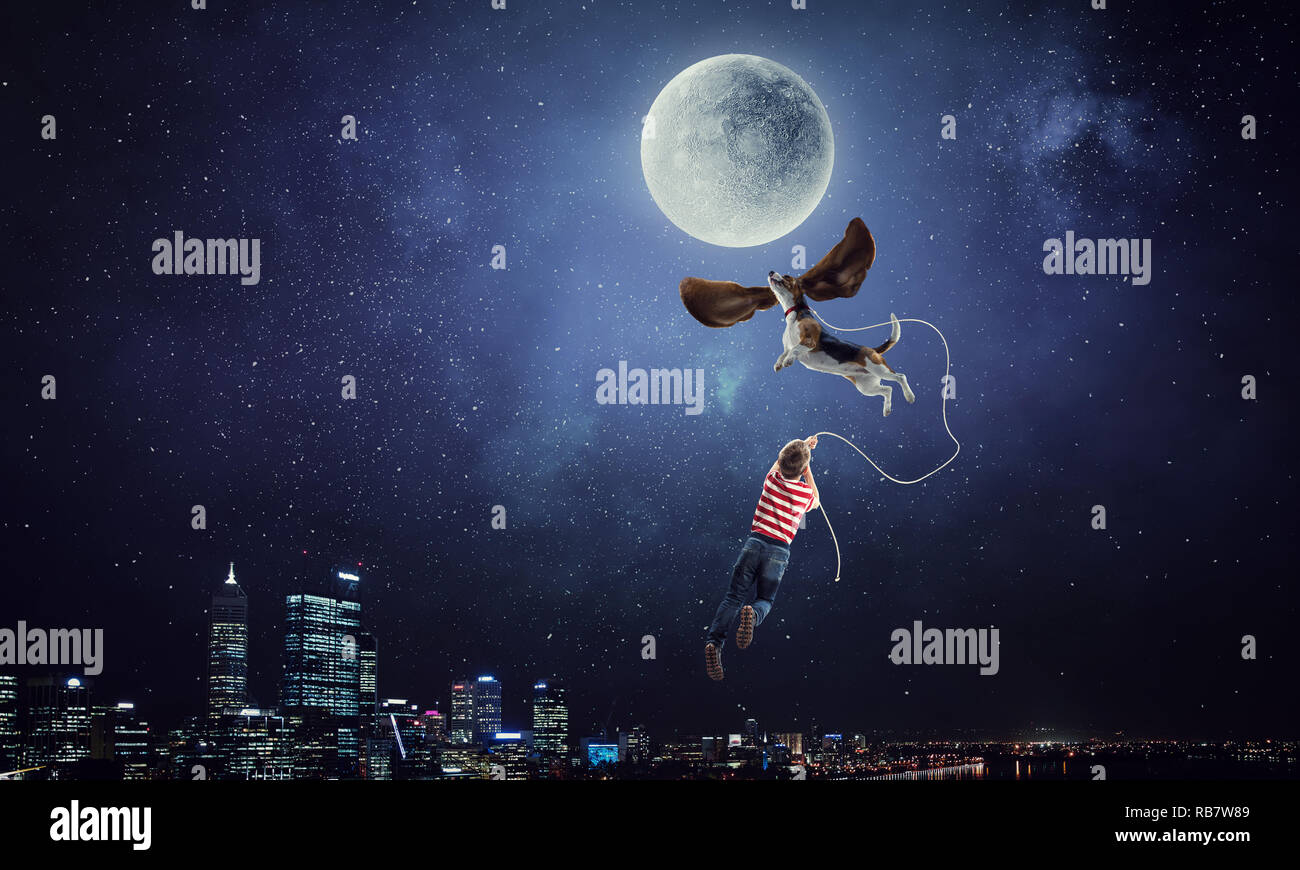 Girl fly in sky. Mixed media Stock Photo - Alamy