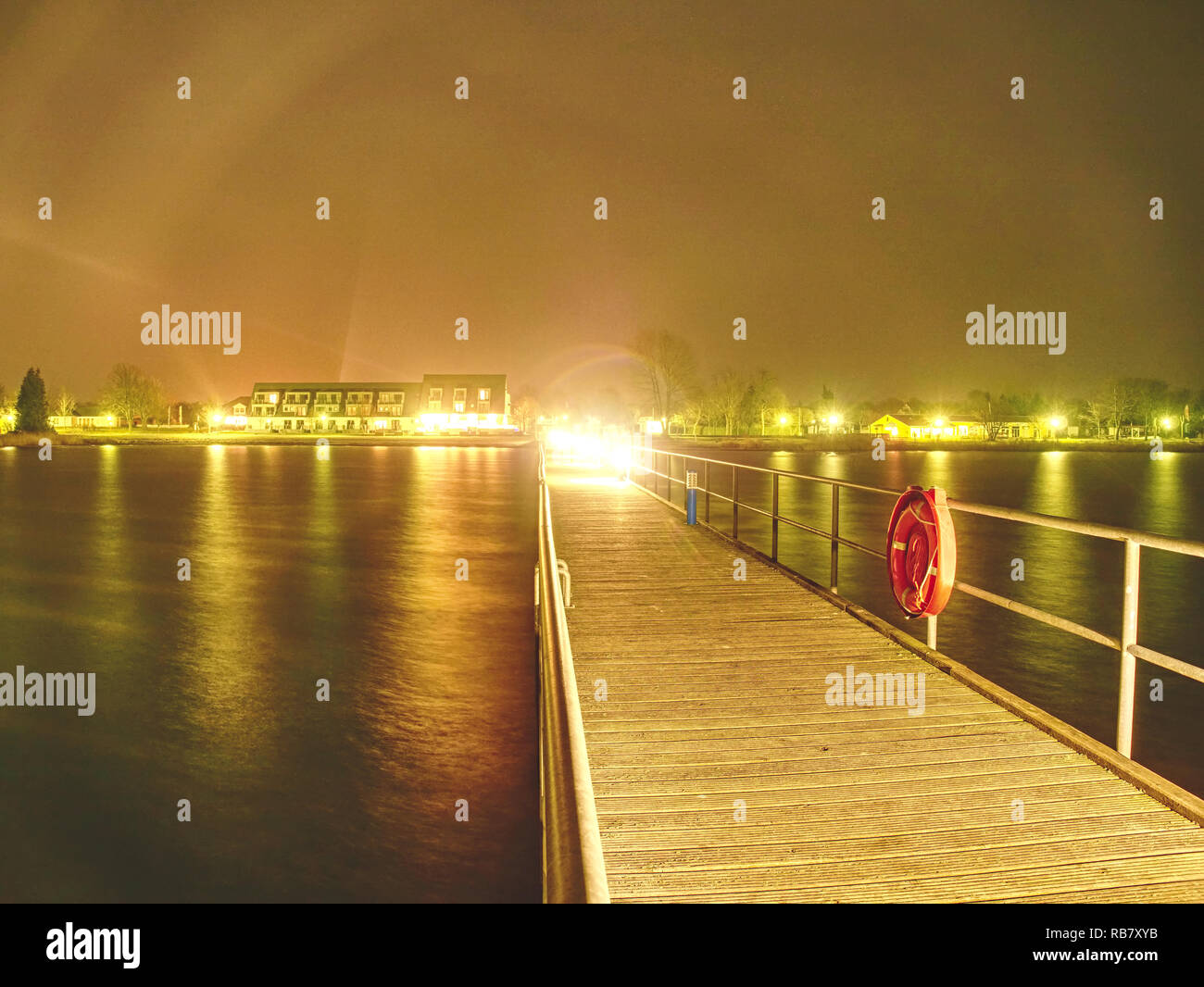 Wooden terrace mole or pier early morning. View of wooden bridge above ...