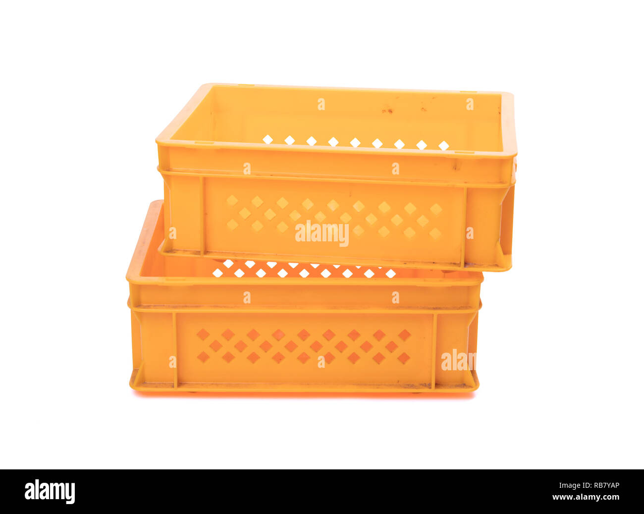 Empty yellow plastic crates isolated on white Stock Photo - Alamy