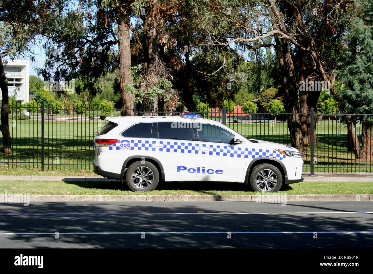 Police car parked on the side of a road Stock Photo - Alamy