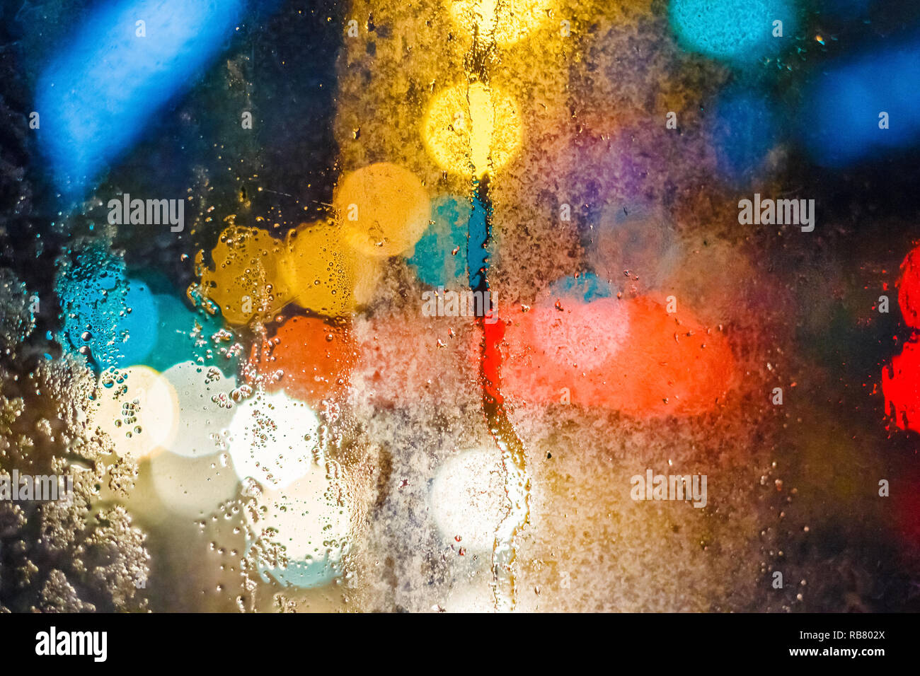 rain drops on window with blurry background Stock Photo - Alamy