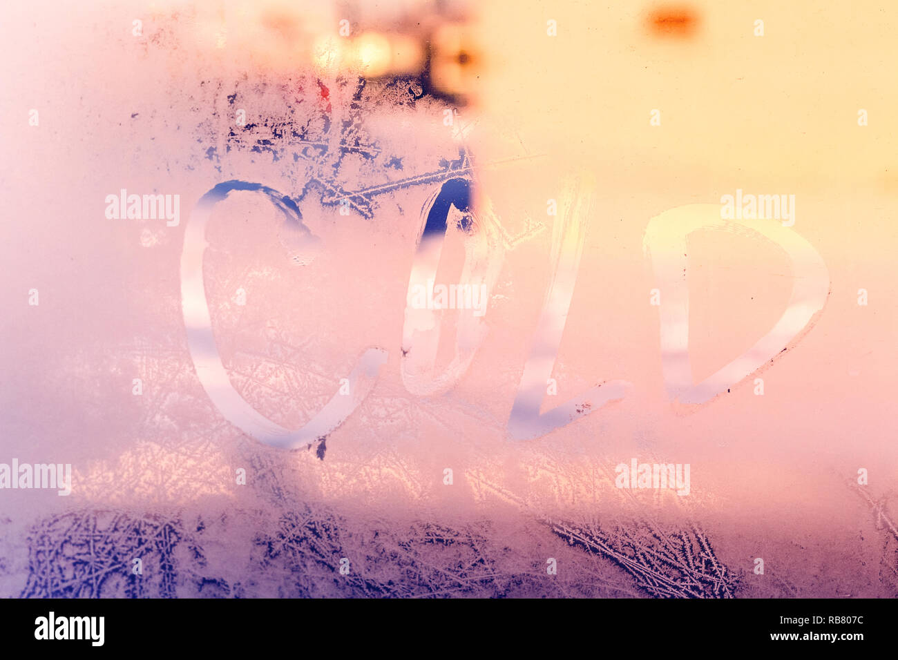Word Cold on the frozen window glass Stock Photo - Alamy